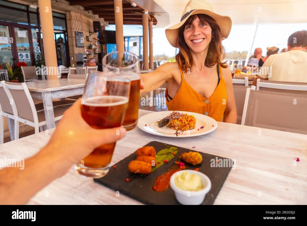 Date with girlfriend in a restaurant having dinner on the beach on ...