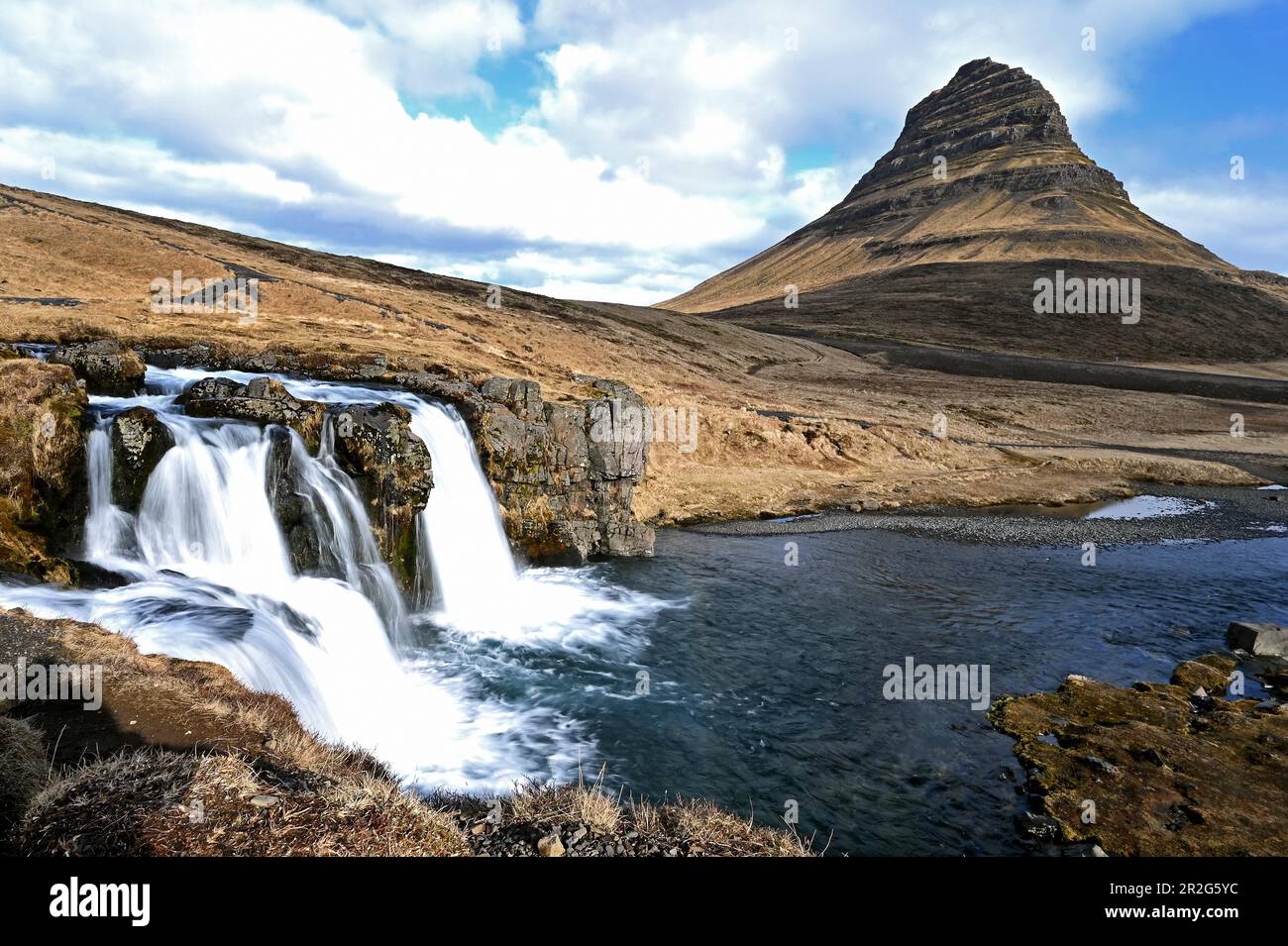 Kirkjufellsfoss waterfall and Kirkjufell mountain on the north coast of ...