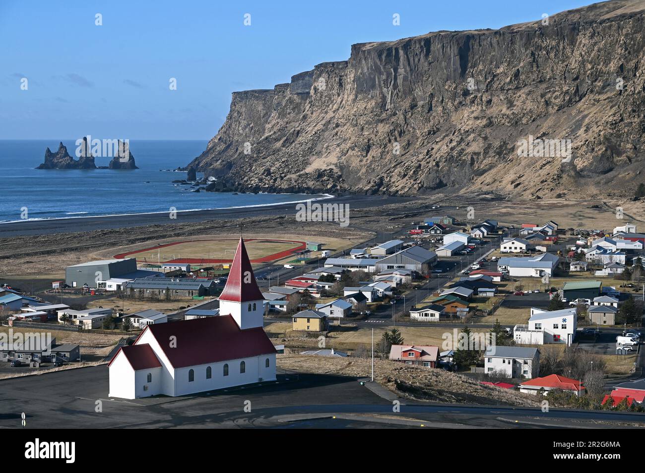 View of Vik and the church Vikurkirkja on the south coast of Iceland ...