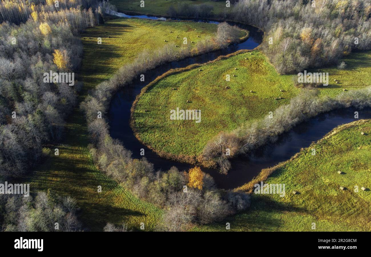 Double river loop through cultural landscape. Aerial view. Sandra ...