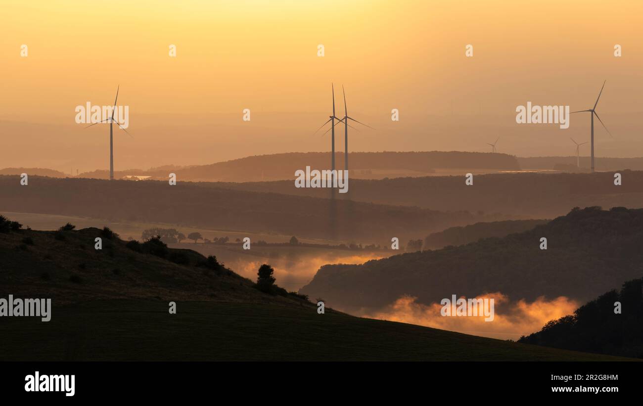 View from Helfenstein on a hilly landscape with wind turbines. Kassel ...