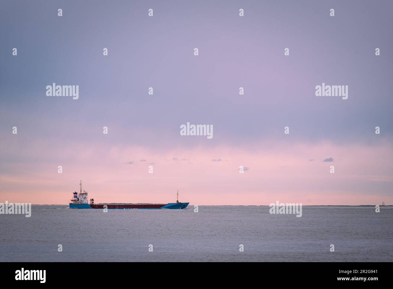 Cargo ship out sea evening hi-res stock photography and images - Alamy