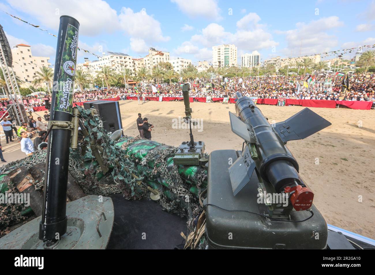 Rockets and launchers are seen on the stage during a rally to ...
