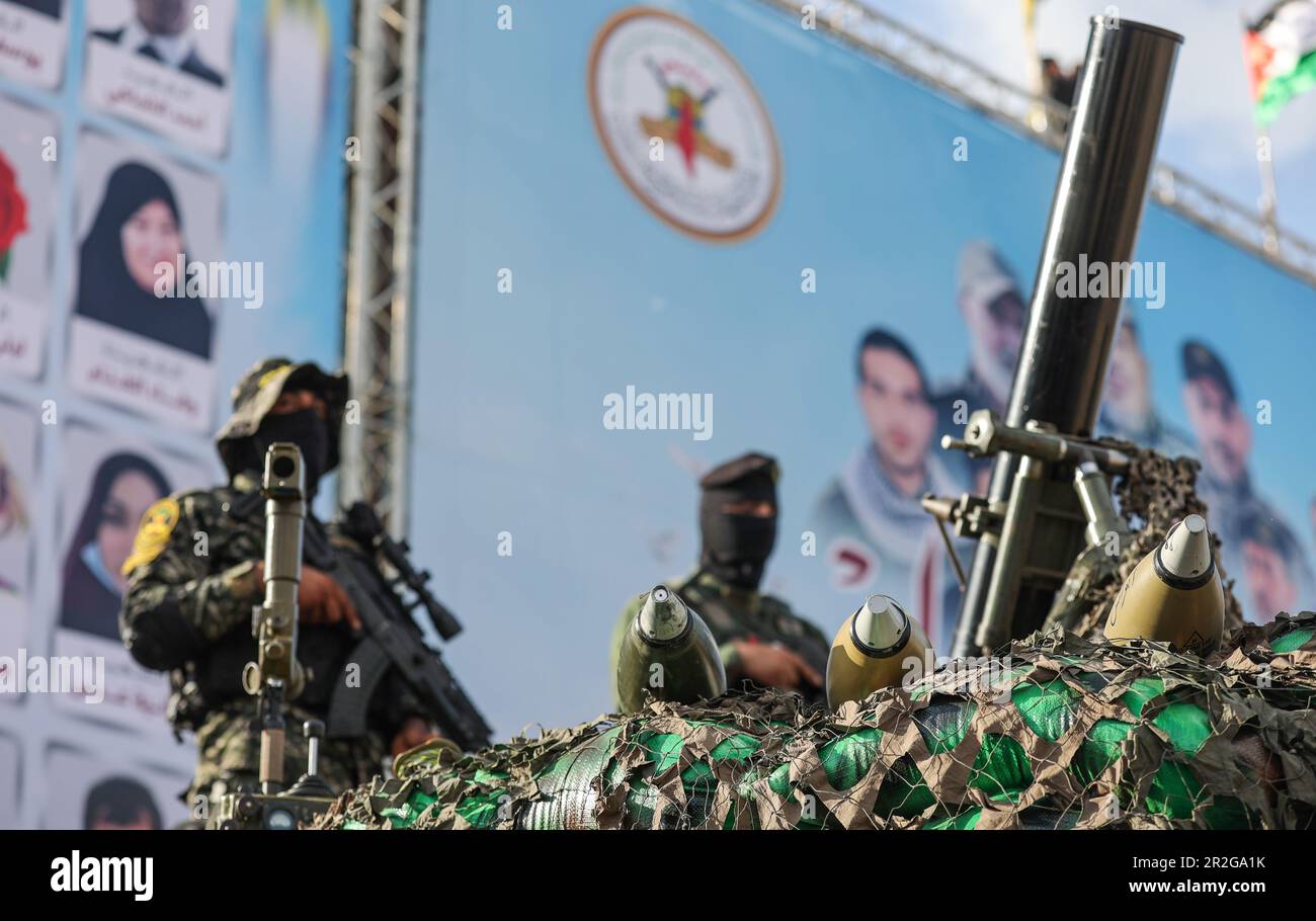 Rockets and launchers are seen on the stage during a rally to ...