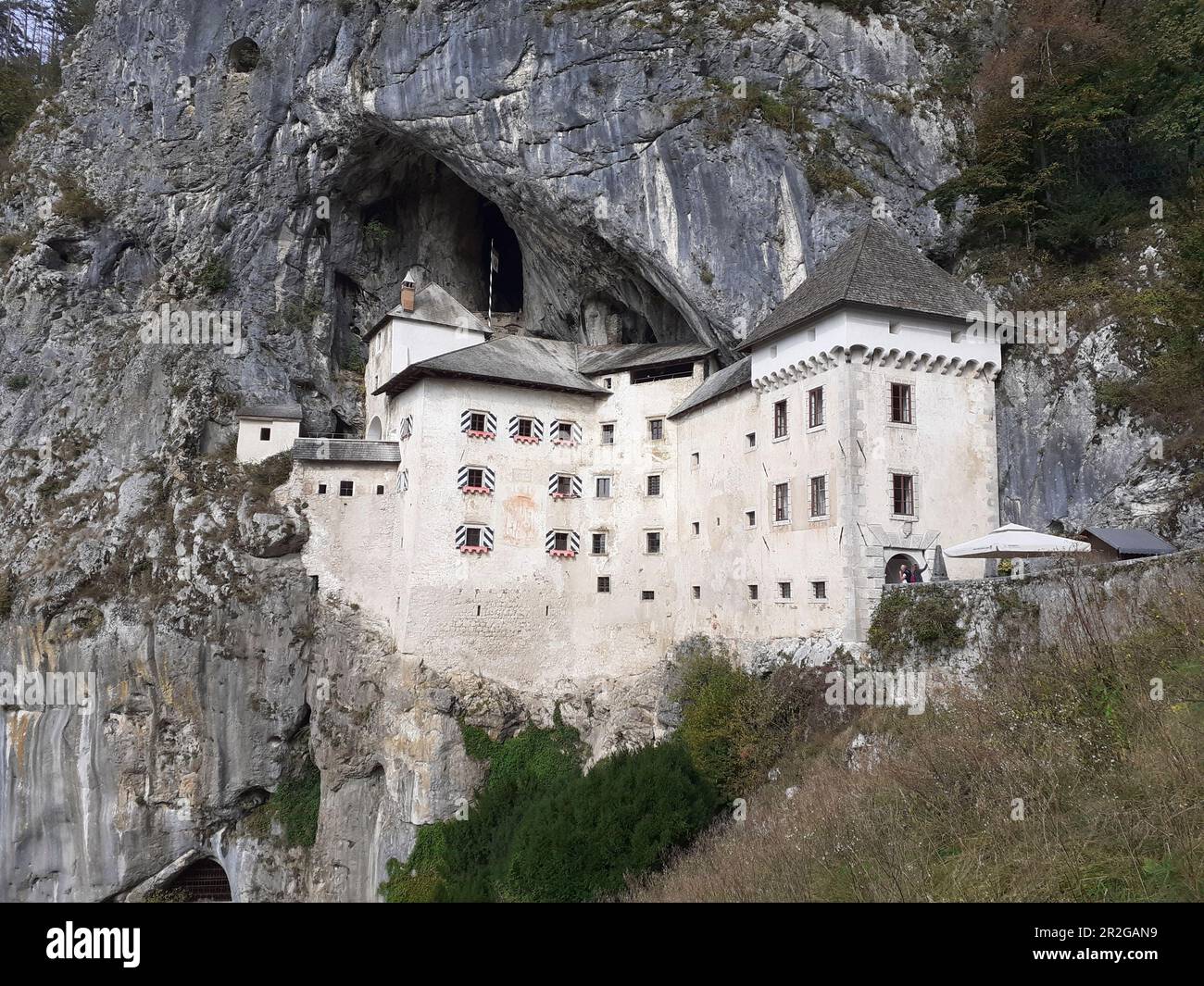 Medieval castle in the rock. Predjama Cave Castle, Postojna, Slovenia ...
