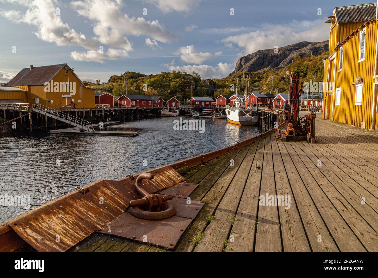 Wooden pier, old warehouse, fishing trawler in Nusfjord, Flakstad ...