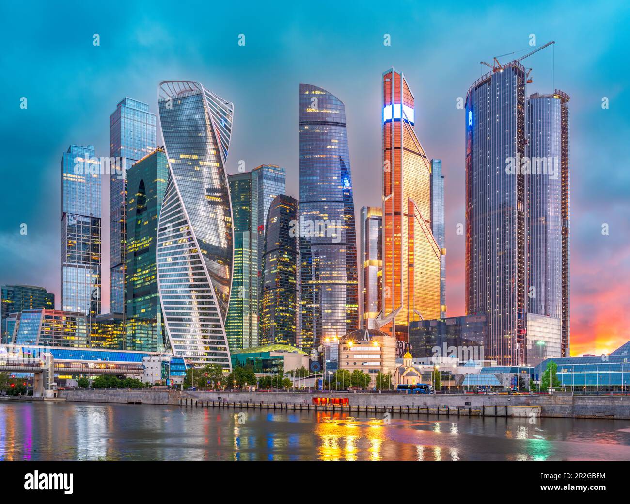 High buildings of Moscow-City at Moskva River at summer sunset, Russia ...