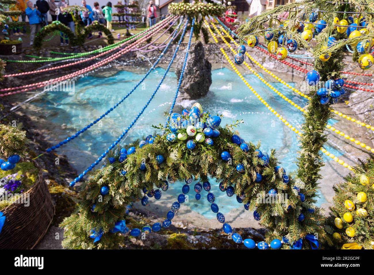Easter fountain decorated with colorful Easter eggs in Bieberbach ...