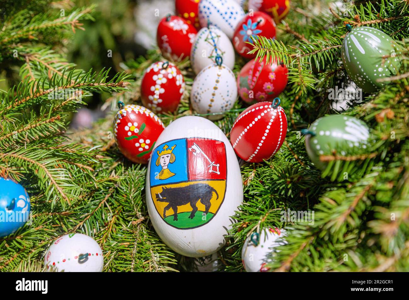 Easter egg with coat of arms, Easter fountain decorated with colorful ...