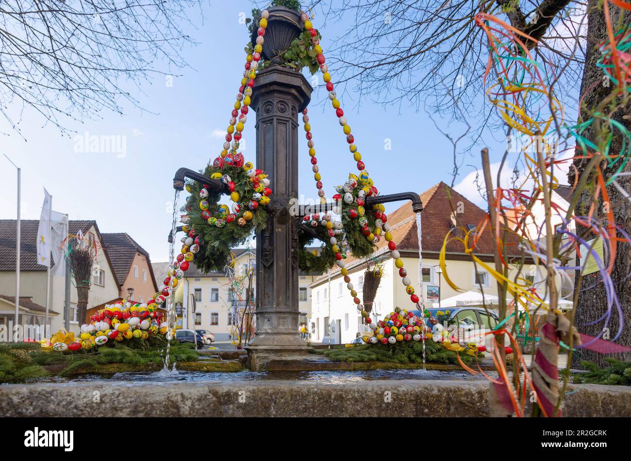 Easter fountain decorated with colorful Easter eggs and colored ribbons ...