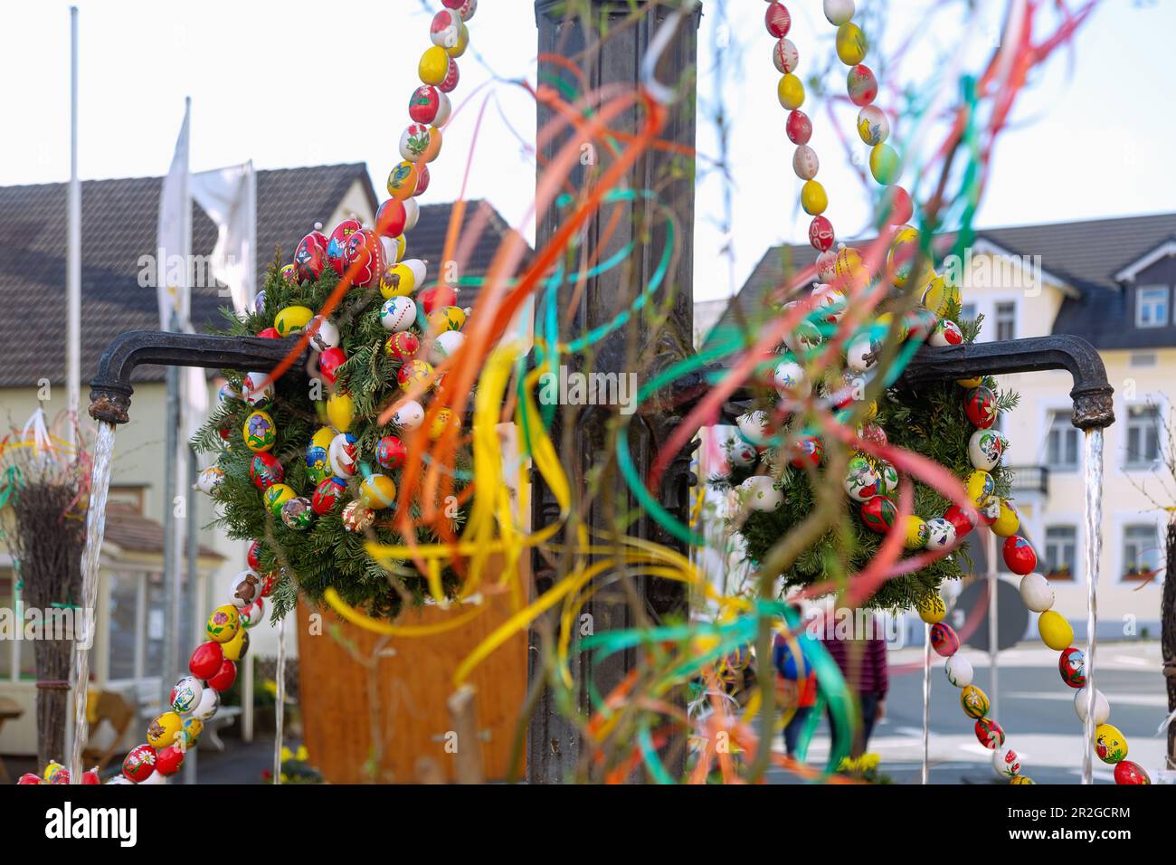Easter fountain decorated with colorful Easter eggs and colored ribbons ...