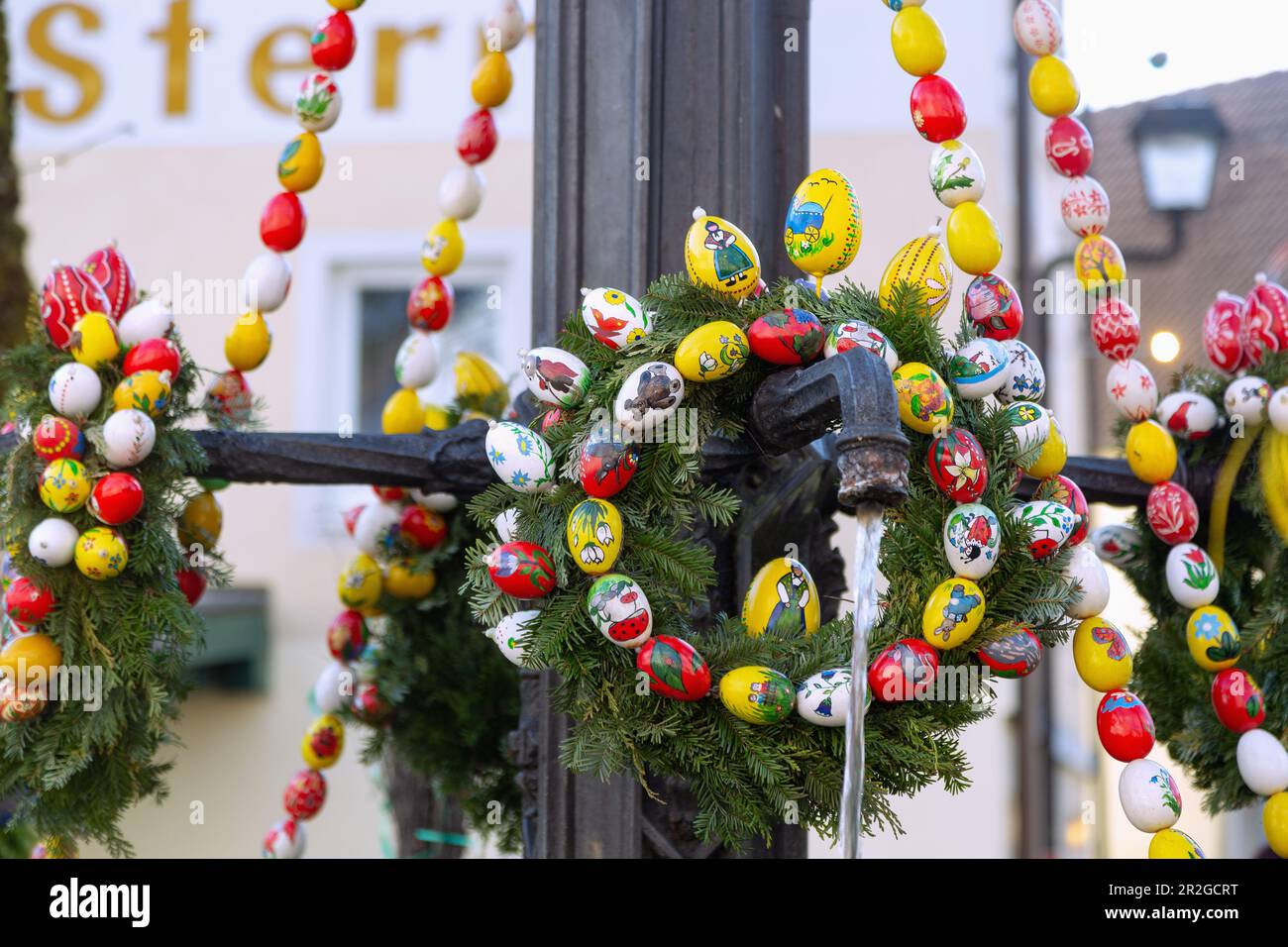 Easter fountain decorated with colorful Easter eggs and colored ribbons ...