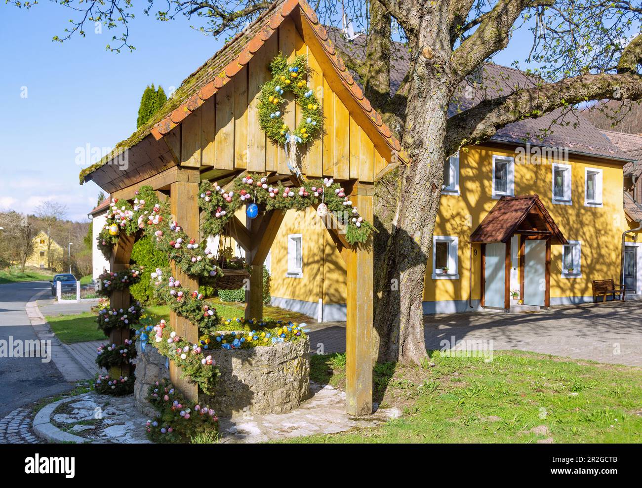Easter fountain decorated with colorful Easter eggs in Wohlmuthshüll in ...