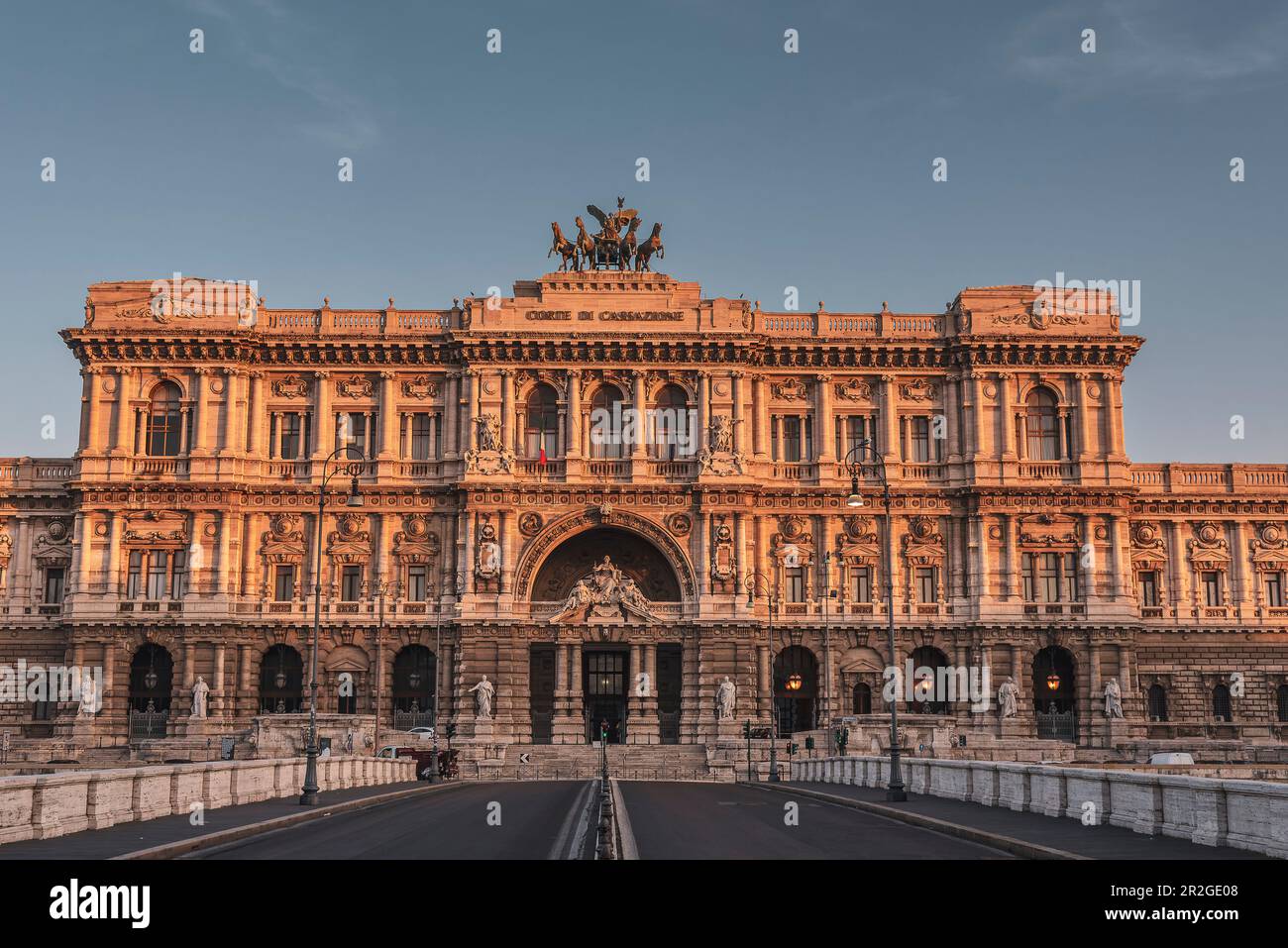 Magnificent building with bronze sculpture on the roof and seat of the ...