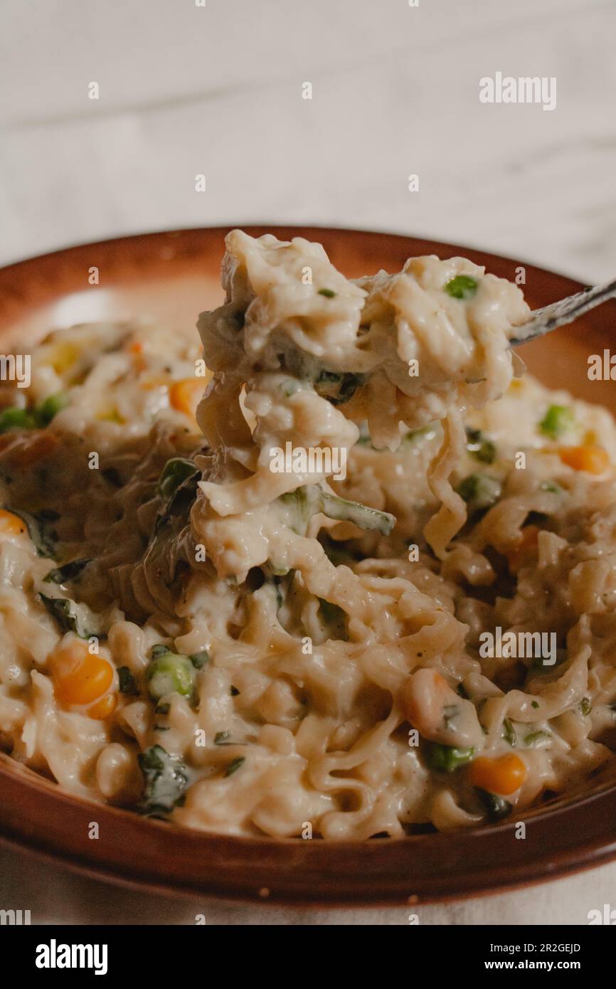 cheesy pasta with vegetables Stock Photo - Alamy