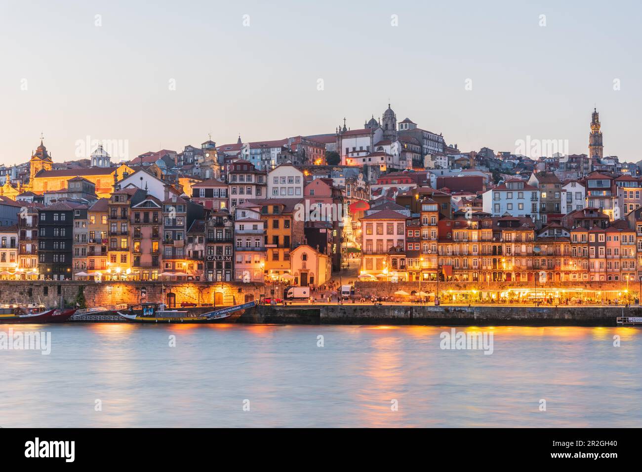 Night shot of the Cais de Ribeira waterfront promenade and the historic ...