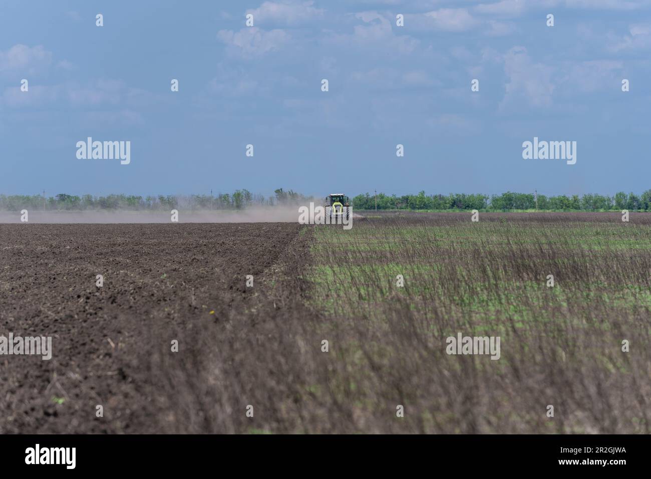 Recently de-mined field is plowed for planting at farm Pershe Travnia ...