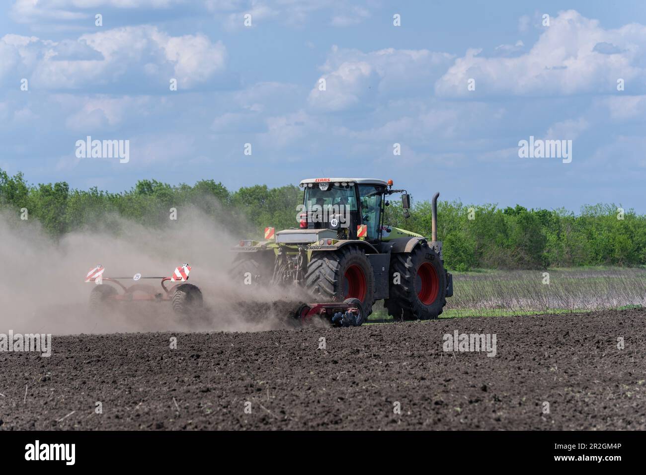 Recently de-mined field is plowed for planting at farm Pershe Travnia ...
