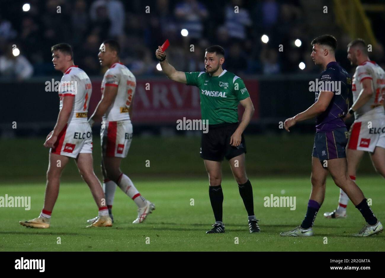 Referee Aaron Moore shows a red card to St Helens' Morgan Knowles (not ...