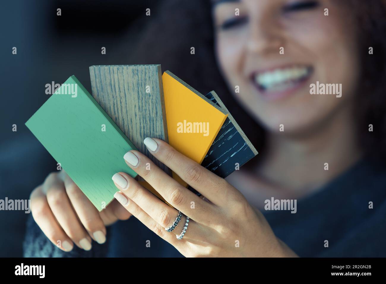 An ethnically diverse, beautiful woman with perfect teeth is seen on ...