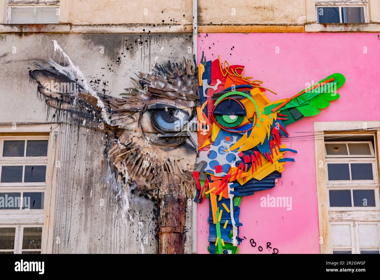 A colorful fantastic mythical creature as street art on a house wall ...