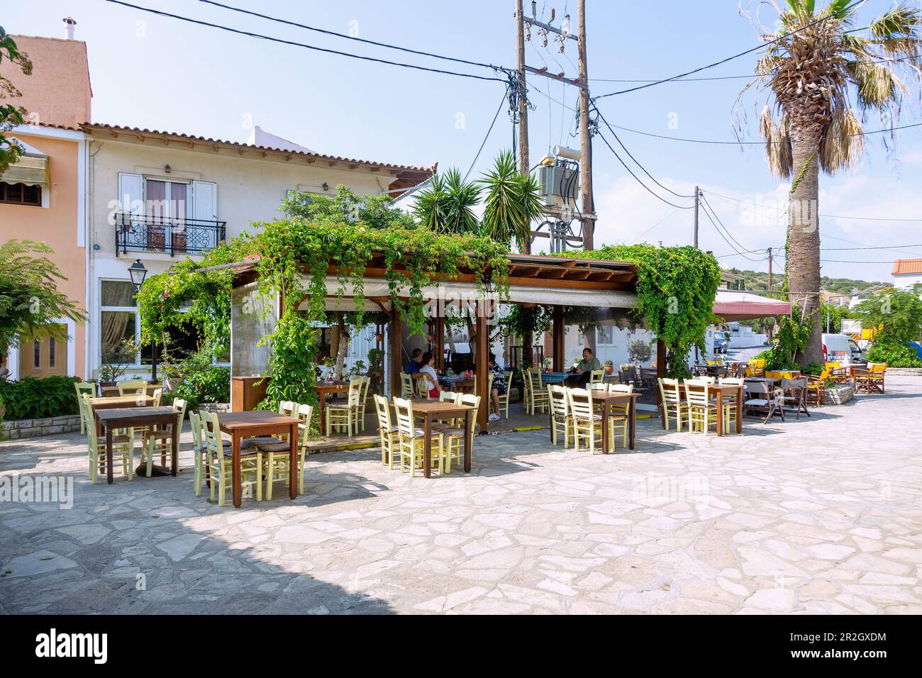 Platea with tavern To Steki tou Manoli in Paleokastro in the east of ...