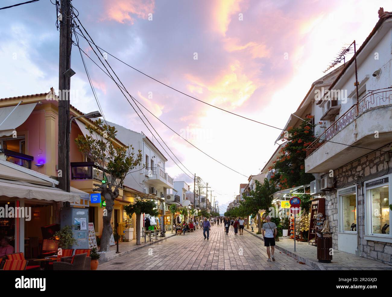 Old town main street and fishing port of Pythagorion in evening light ...