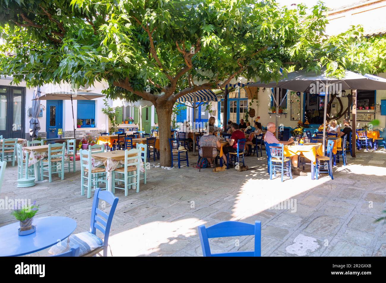 Tavern Blue Chairs Restaurant on the Platia of Vourliotes in the north ...
