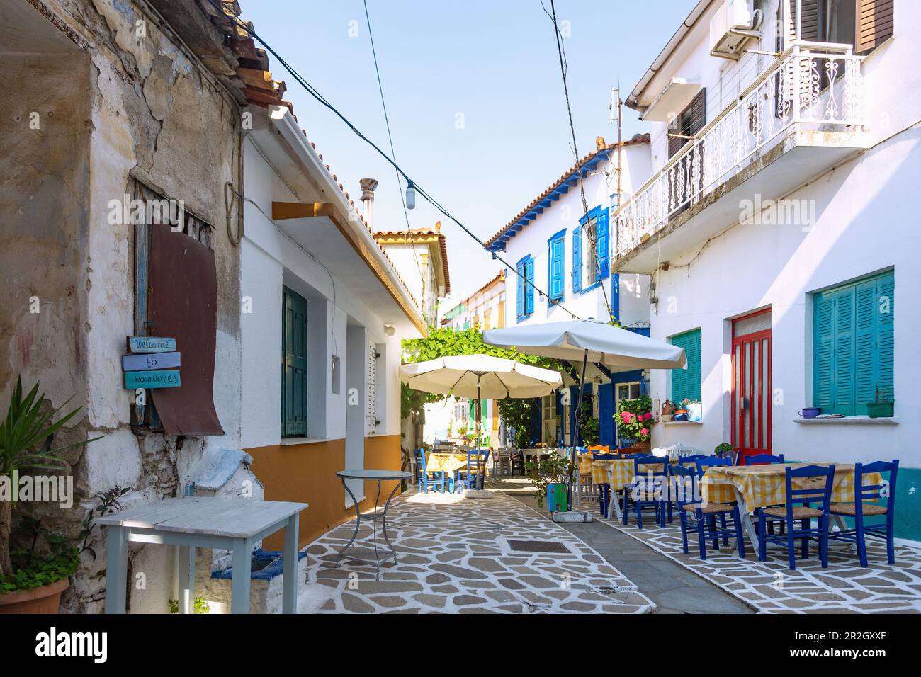 Alley with taverns in the mountain village of Vourliotes in the north ...