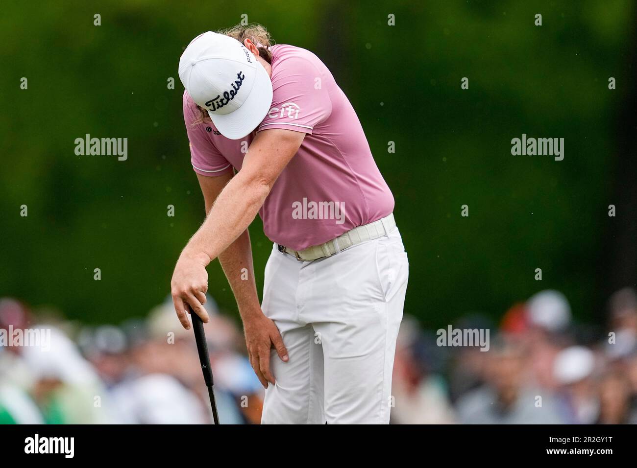 Cameron Smith, of Australia, reacts after missing a putt on the ninth ...