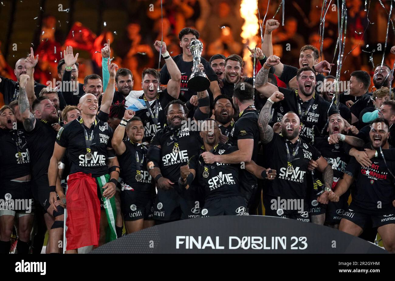 Toulon's Mathieu Bastareaud lifts the trophy with team-mates as they ...