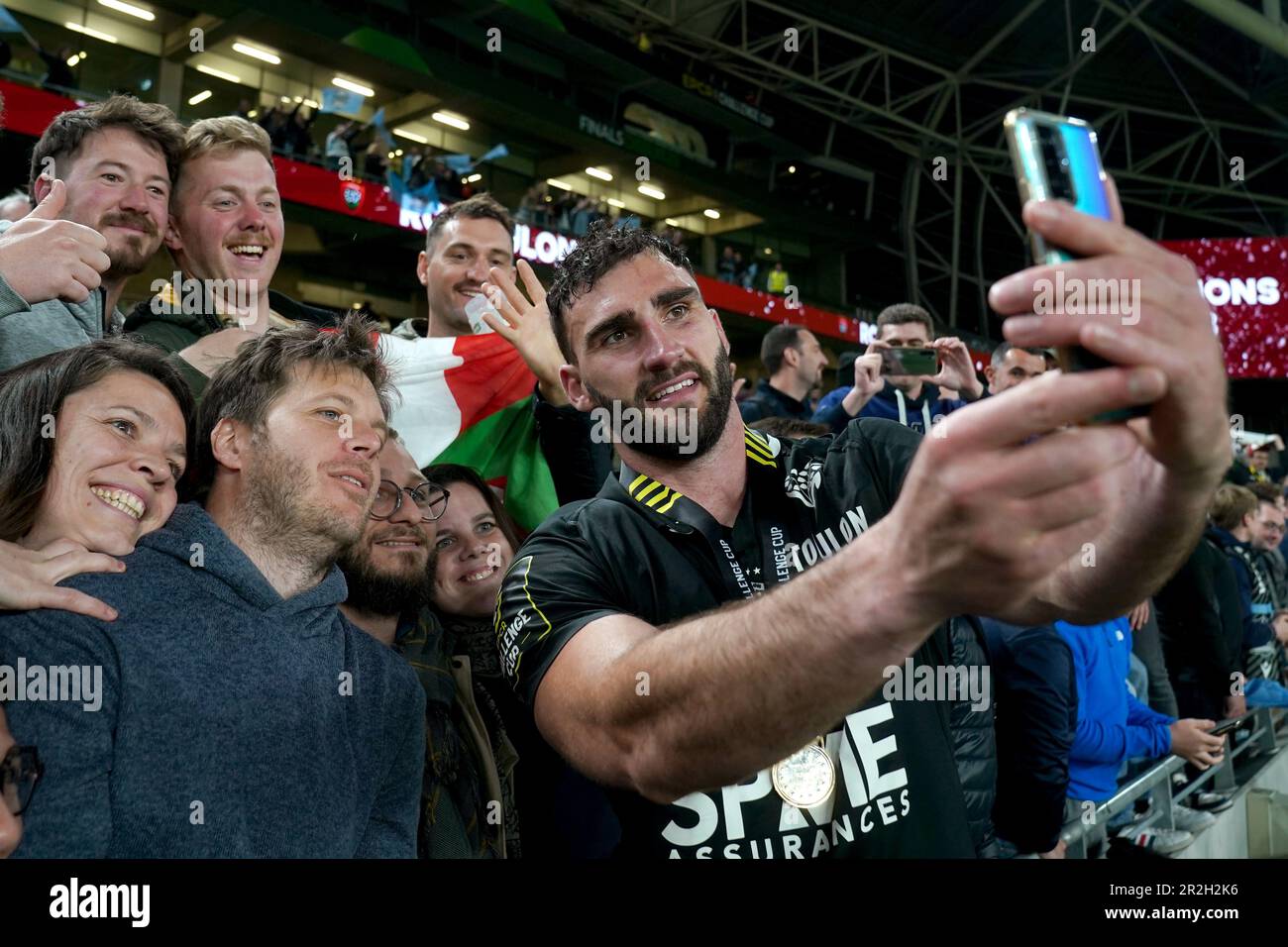 Toulon's Charles Ollivon poses for a photograph with fans after winning ...