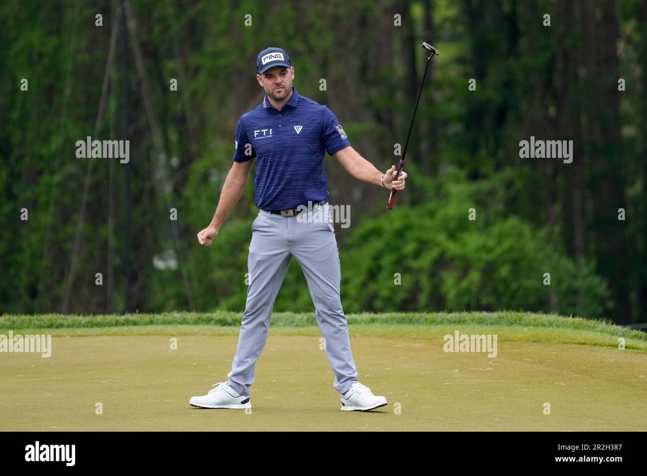 Corey Conners, of Canada, celebrates after a birdie on the second hole ...