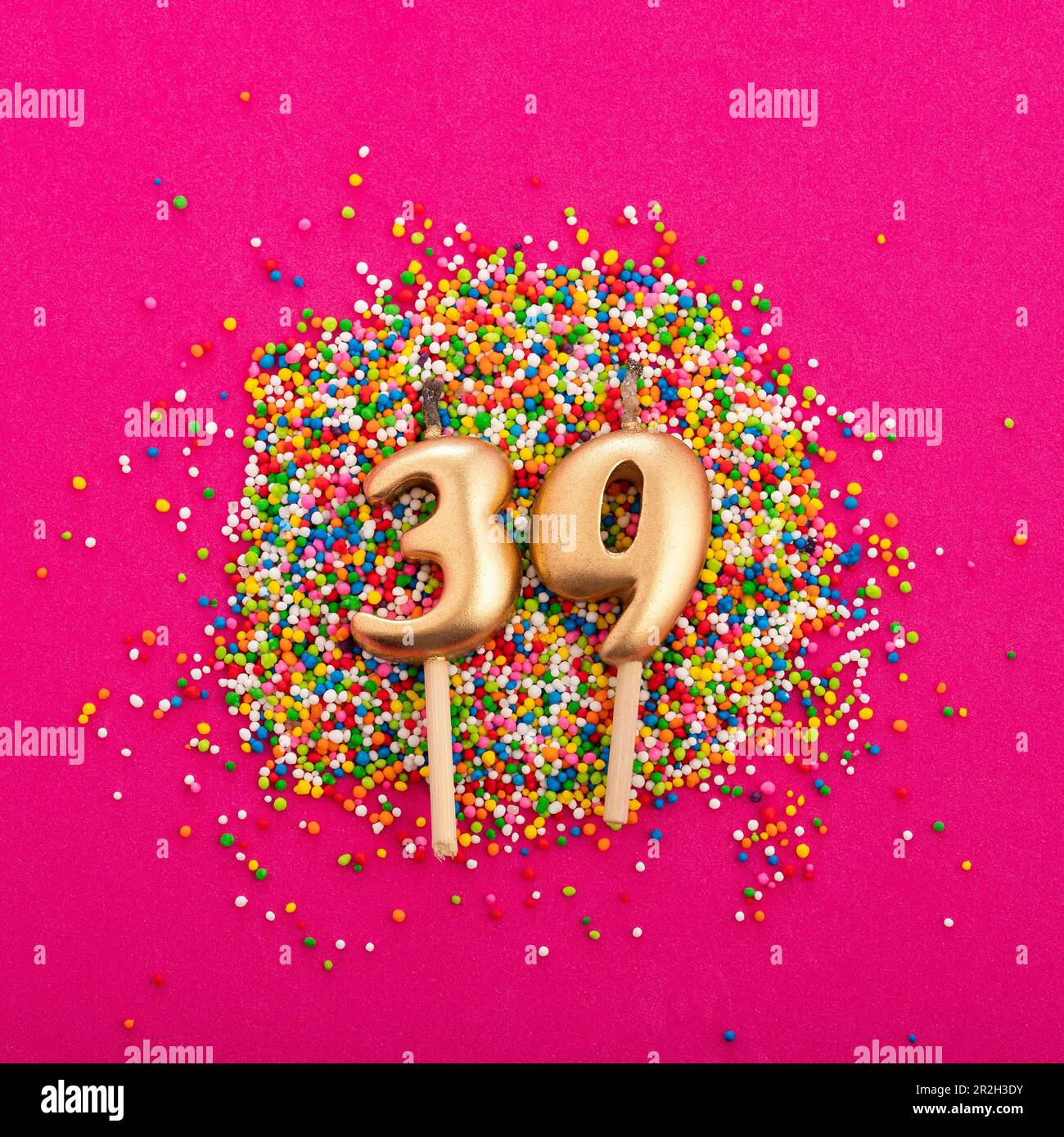 Candle number 39 - Birthday or anniversary on rhodamine red background ...