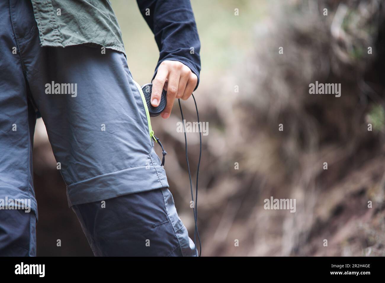 A young hand carefully tucks a compass into the pocket, embarking on a ...