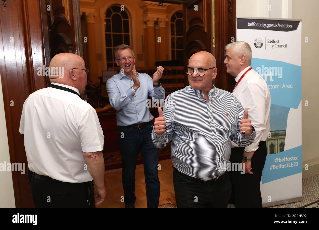 DUP candidate Ian McLaughlin (2nd right), who has won a seat, at ...