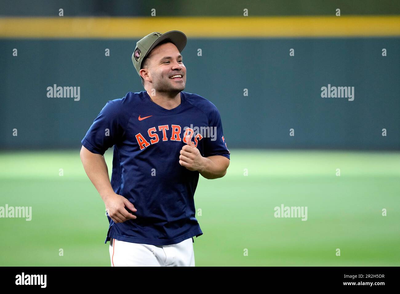 Houston Astros' Jose Altuve stretches during batting practice before a ...