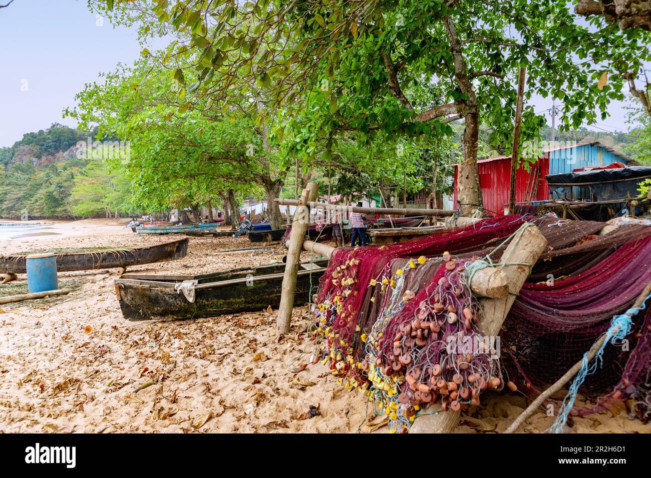 Fishing nets hung out to dry with colorful floats at Praia das Burras ...