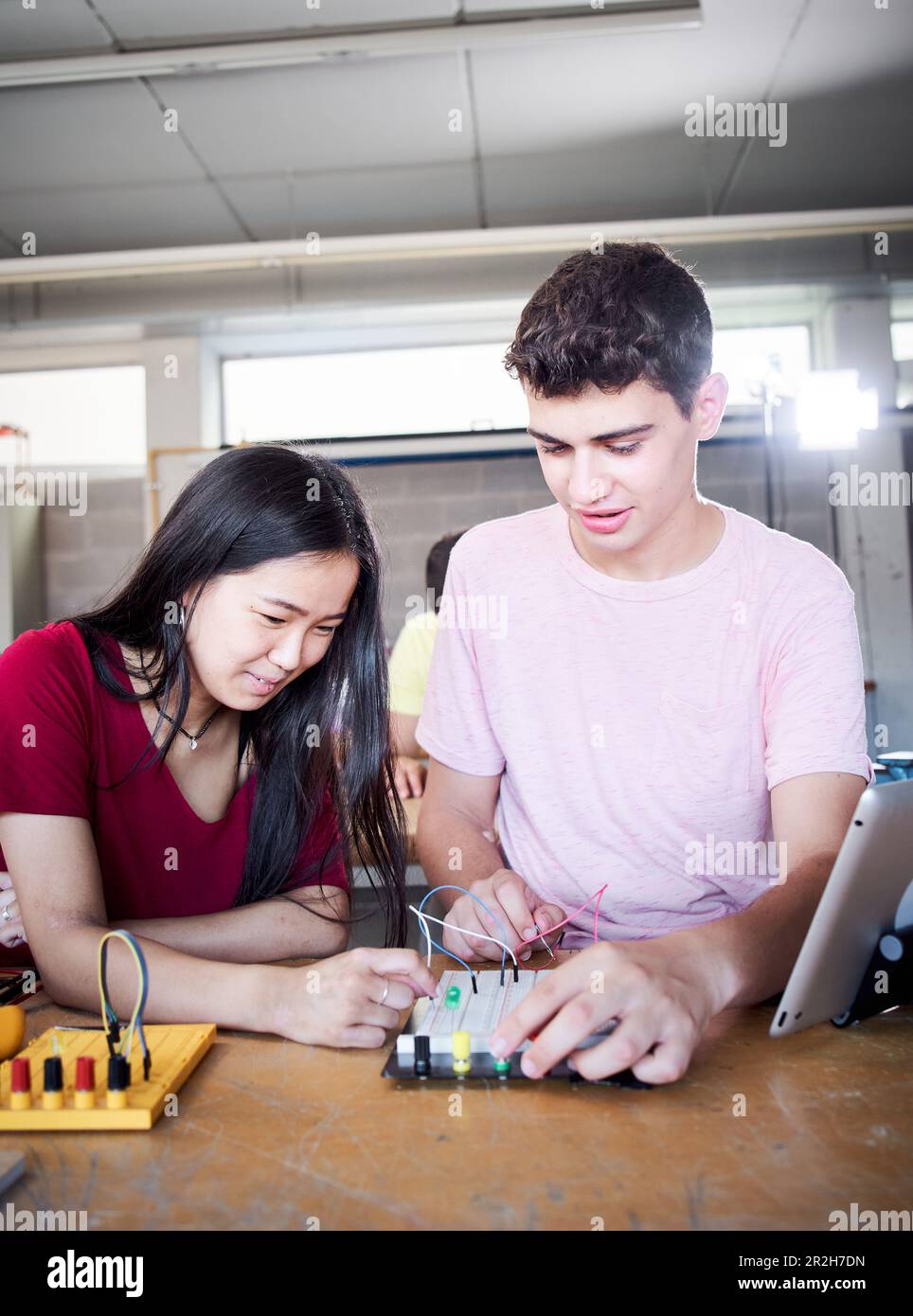 Vertical multiracial boy and girl students at technical high school ...
