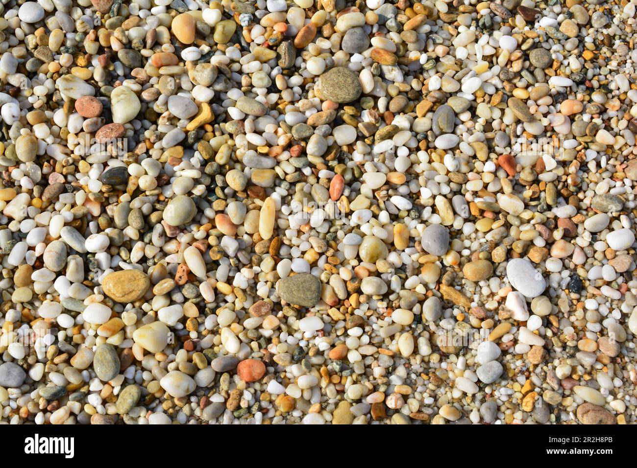 Colorful gravel backgraund, top view, summer vibe, Pefkari beach ...