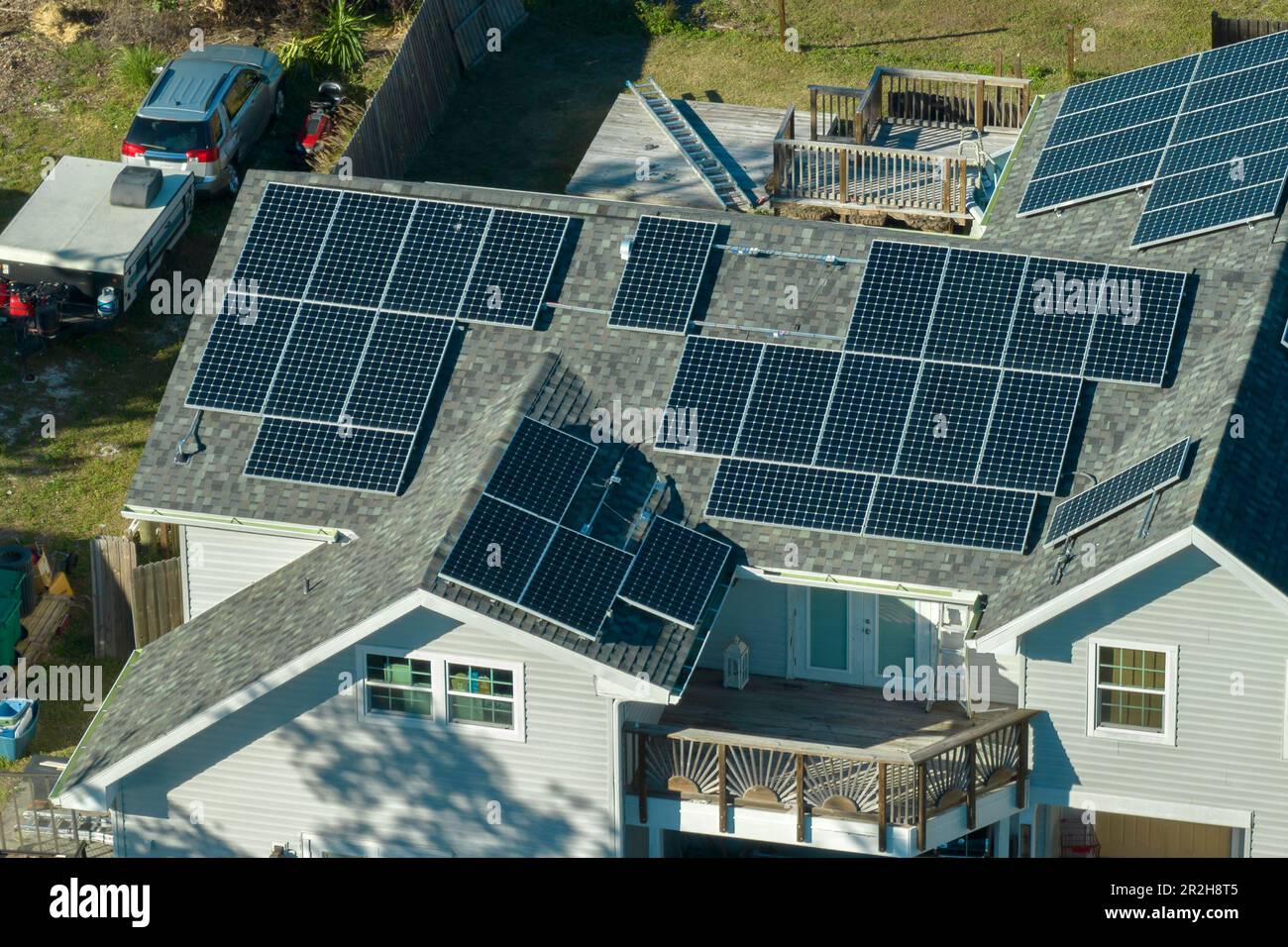 Residential house in USA with rooftop covered with solar photovoltaic ...