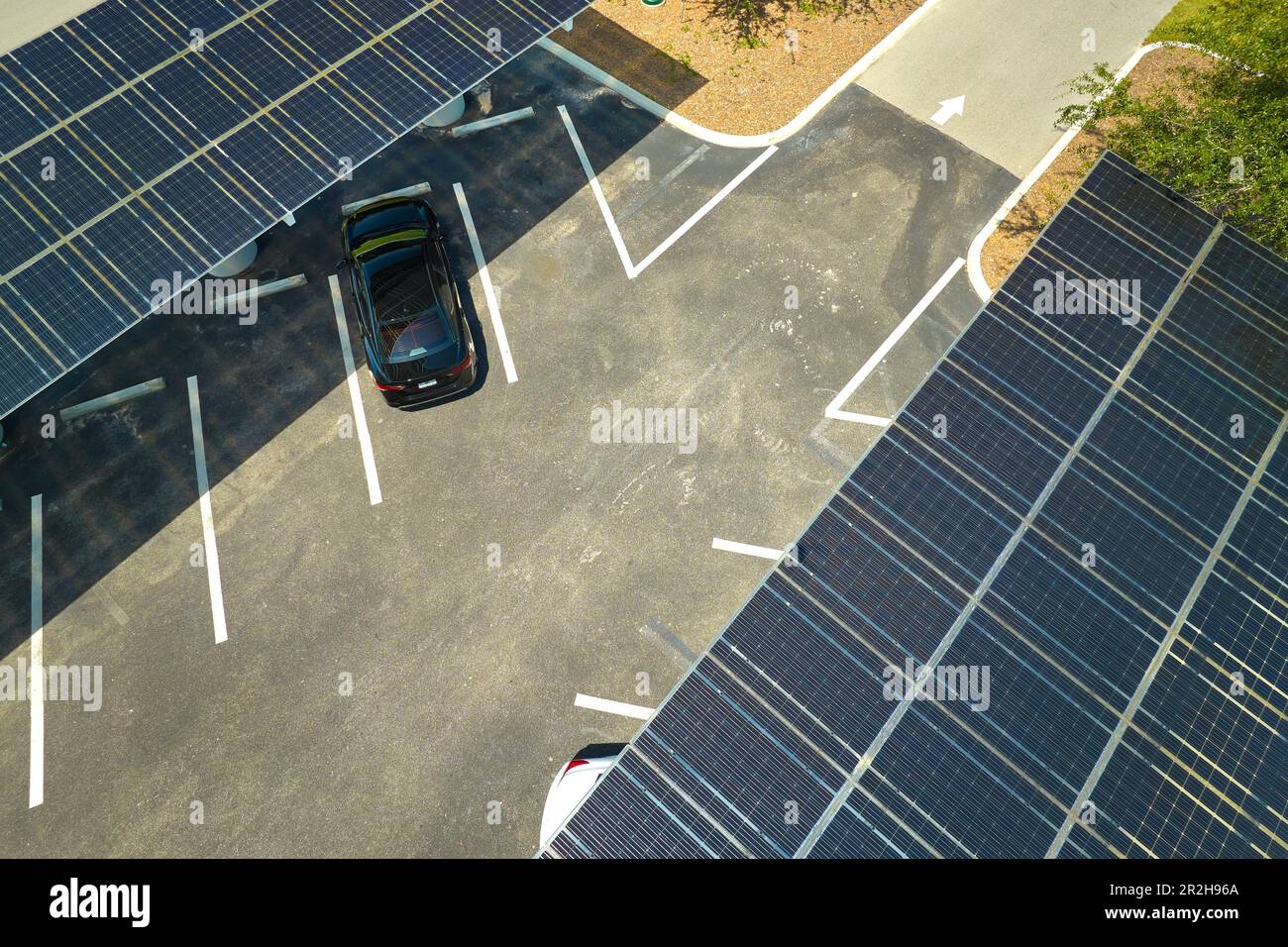 Solar panels installed over parking lot for parked cars for effective ...