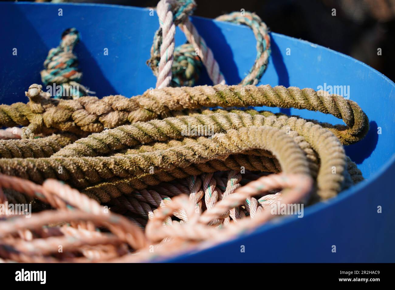 Bucket full of fishing ropes used by fishermen Stock Photo - Alamy
