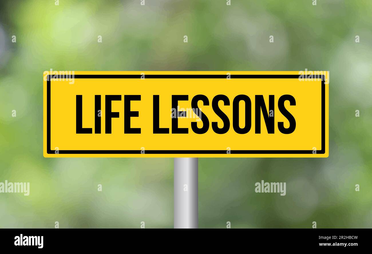 Life lessons road sign on blur background Stock Photo - Alamy