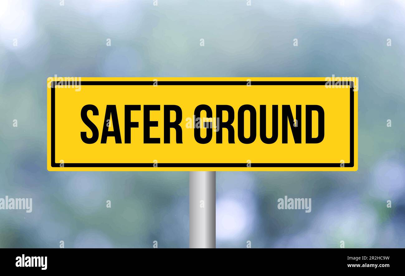 Safer ground road sign on blur background Stock Photo - Alamy