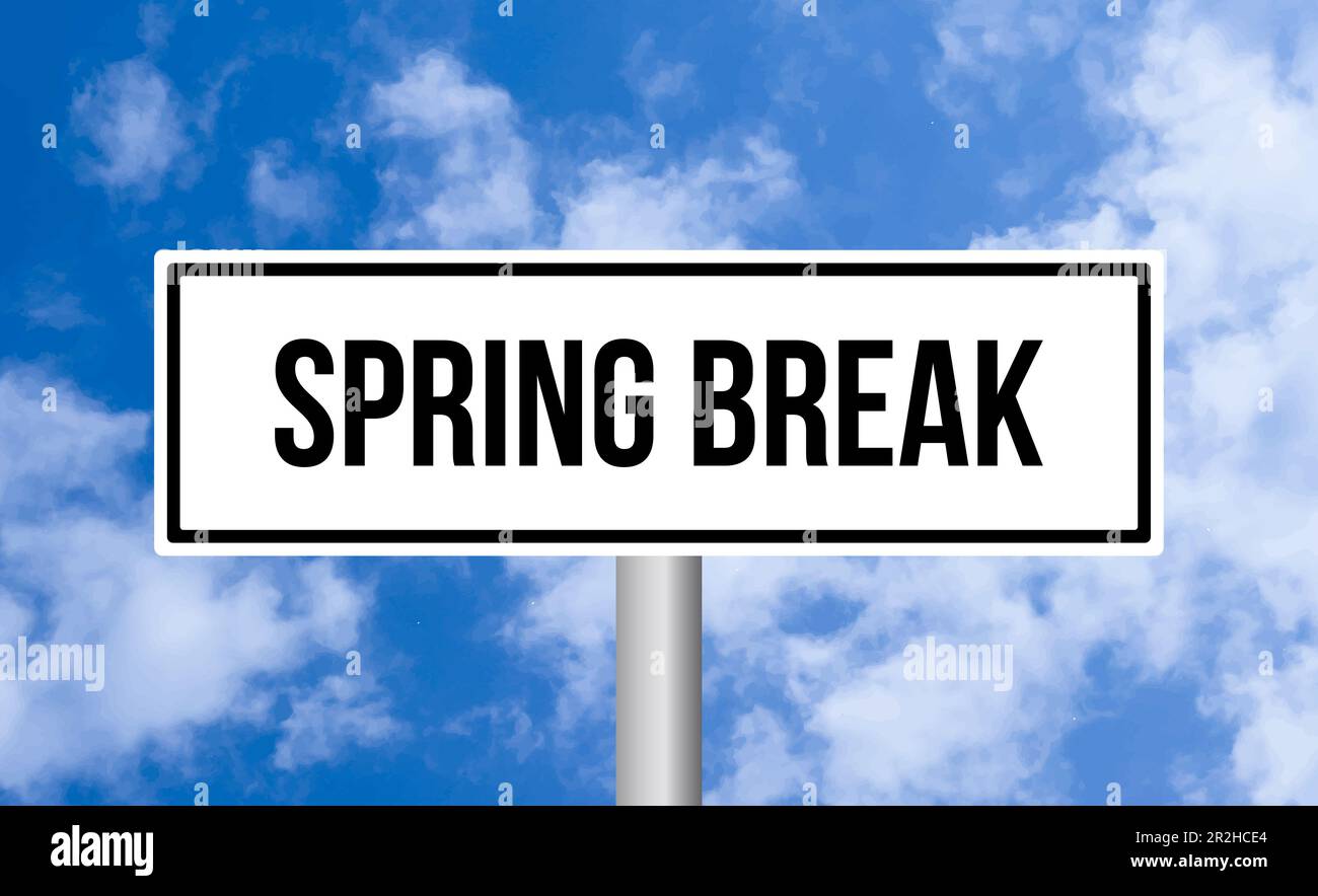 Spring break road sign on sky background Stock Photo - Alamy