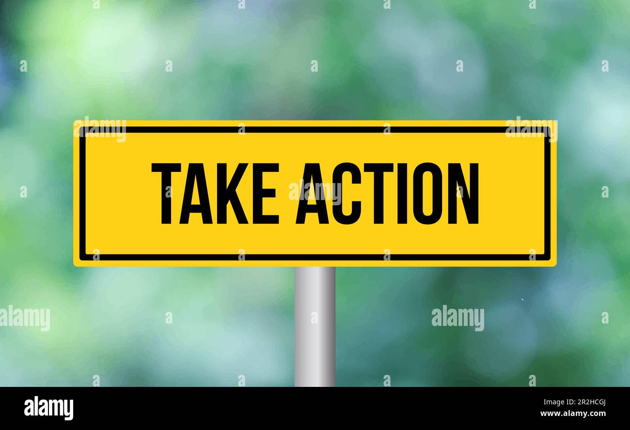Take action road sign on blur background Stock Photo - Alamy