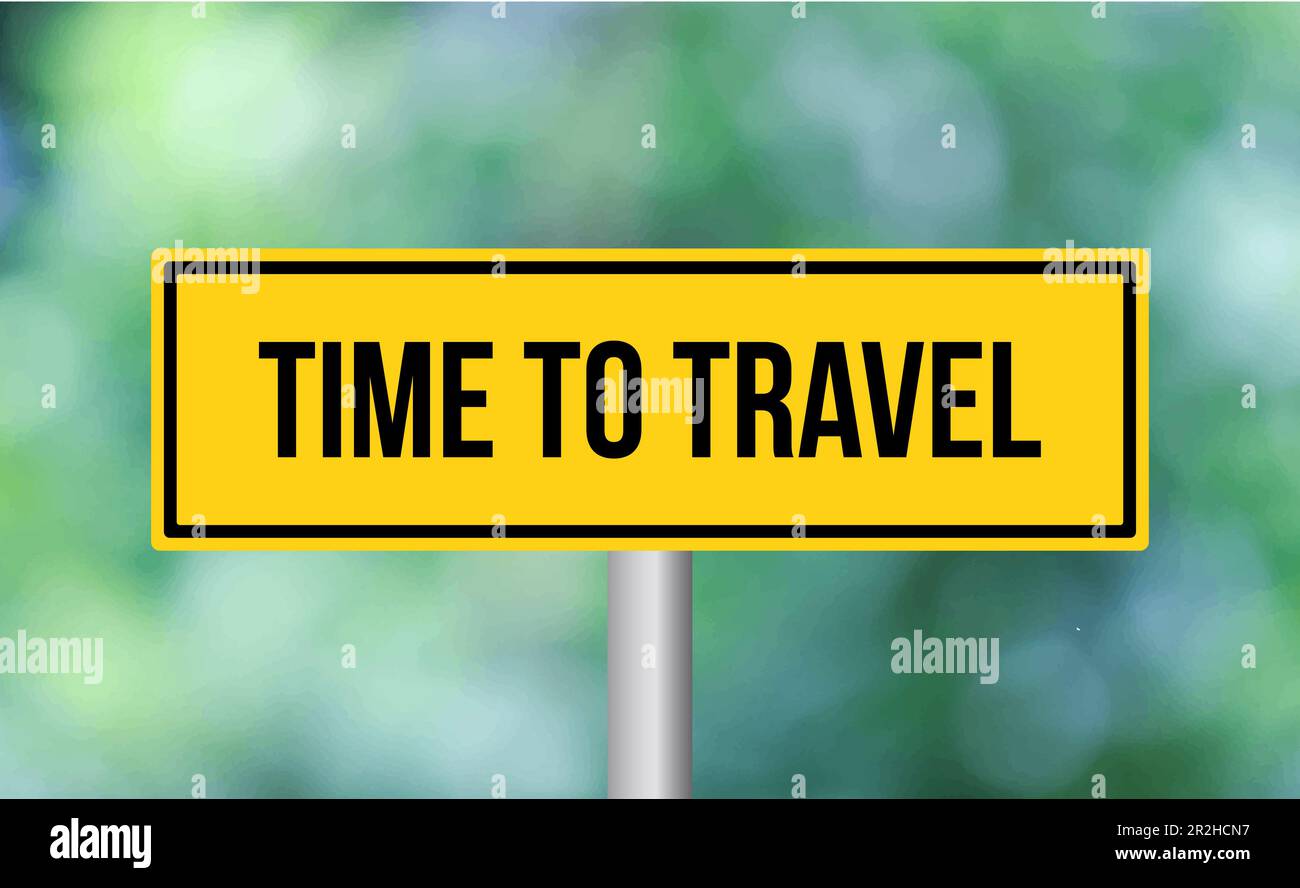 Time to travel road sign on blur background Stock Photo - Alamy
