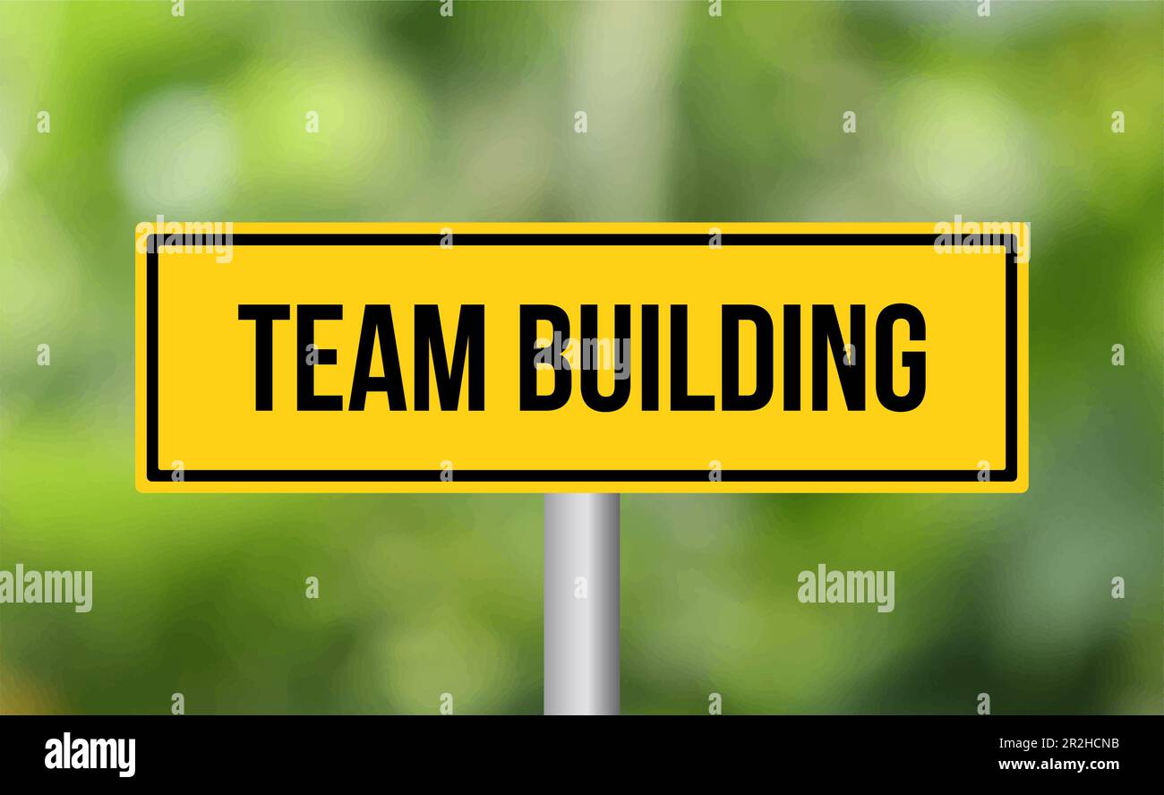 Team building road sign on blur background Stock Photo - Alamy