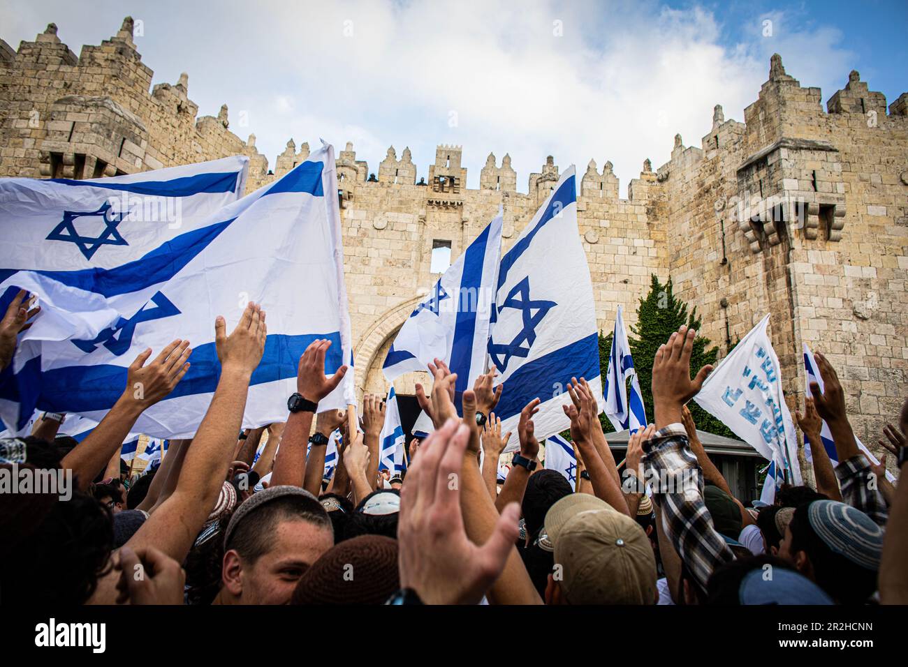 Jerusalem, Israel. 18th May, 2023. Israeli youths wave Israeli flags ...